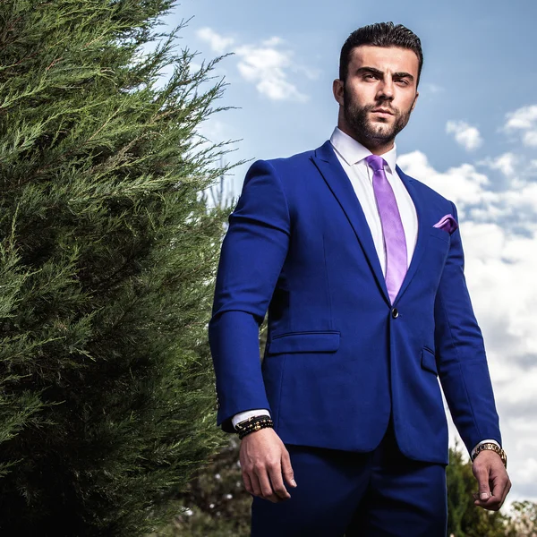 Elegant handsome man in classical costume pose outdoor. Stock Photo by ...