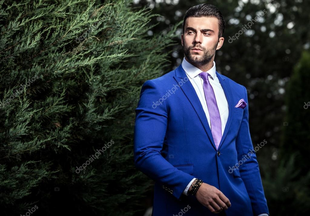 Elegant handsome man in classical costume pose outdoor. Stock Photo by ...