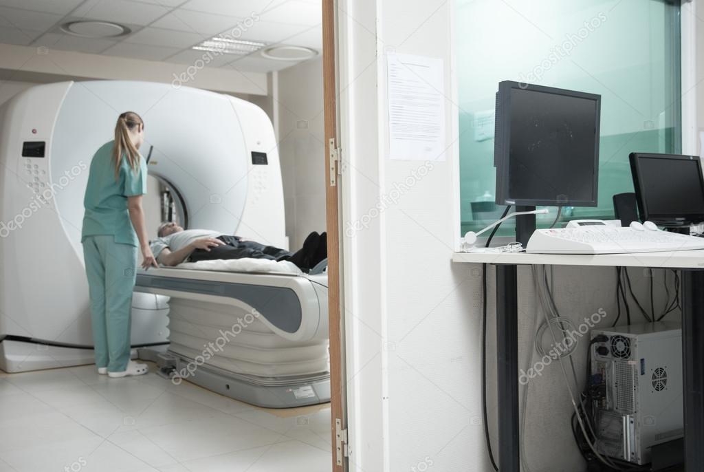 Hospital room with computer and monitors. Female doctor and male Stock ...
