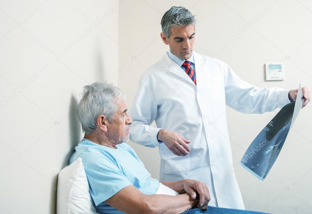 Doctor explaining medical scan test Stock Photo by ©jovannig 61475803