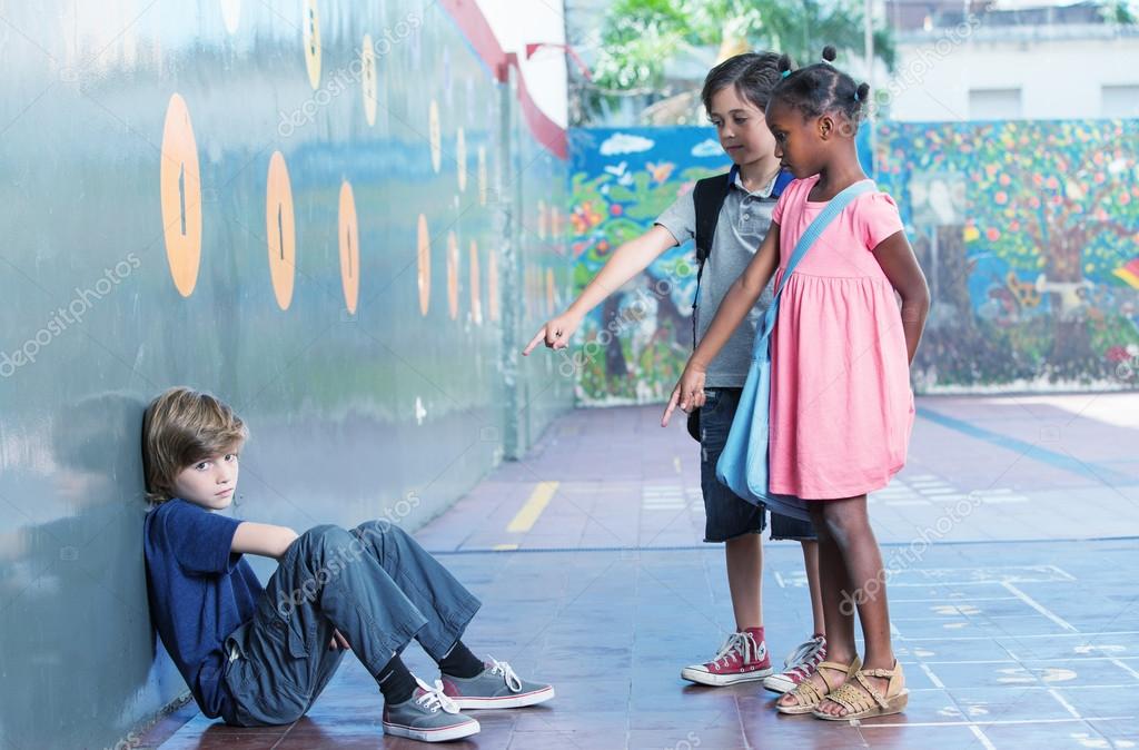 Little kids bullying kid in schoolyard Stock Photo by ©jovannig 62297495