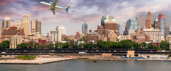 Aircraft overflying New York City skyline Stock Photo by ©jovannig 84238906