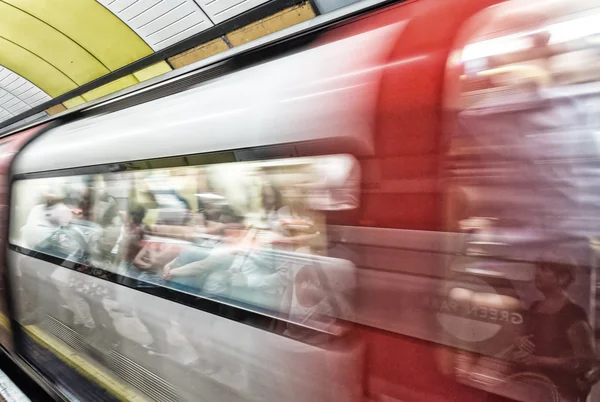 London underground train fast moving in city station - Stock Image ...