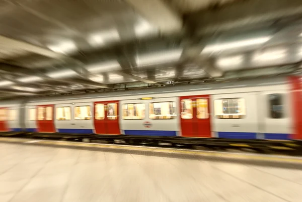 London underground train fast moving in city station - Stock Image ...