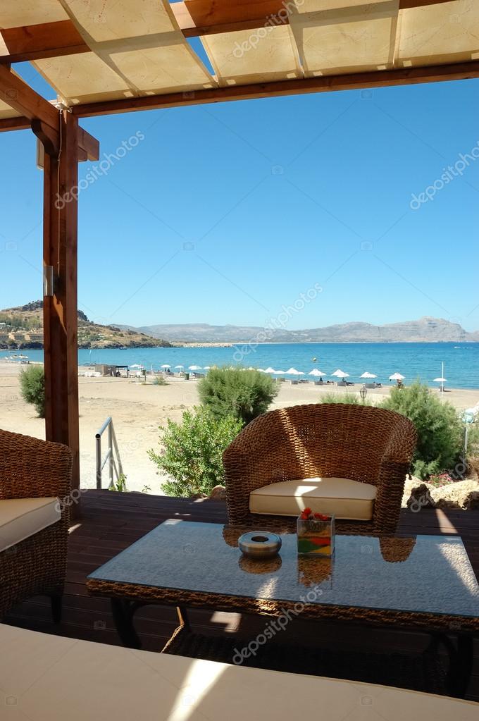 Chairs and table of a beach bar Stock Photo by ©rcaucino 87997468