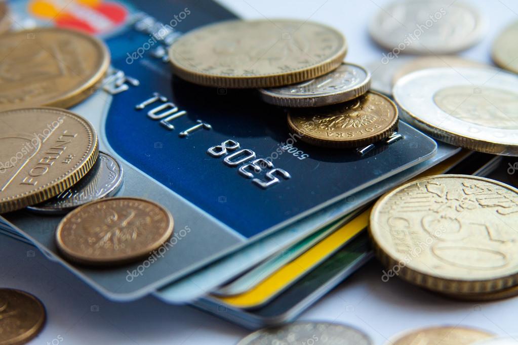 Credit card and coins — Stock Editorial Photo © fajnokg #57455329