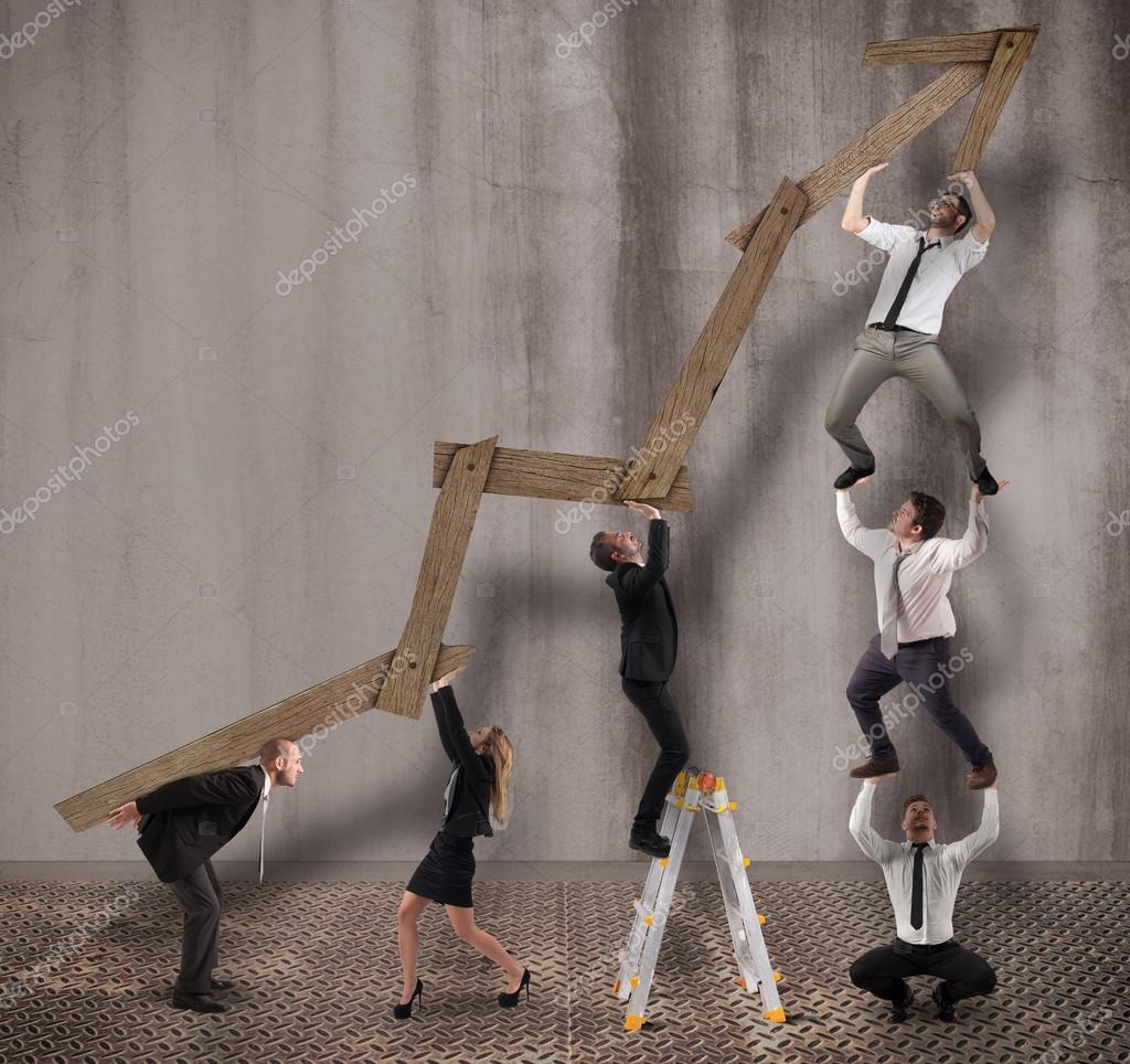 Business team building an arrow Stock Photo by ©alphaspirit 108539722