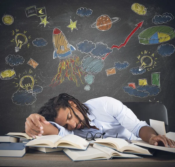 Teacher sleeping on desk - Stock Image - Everypixel