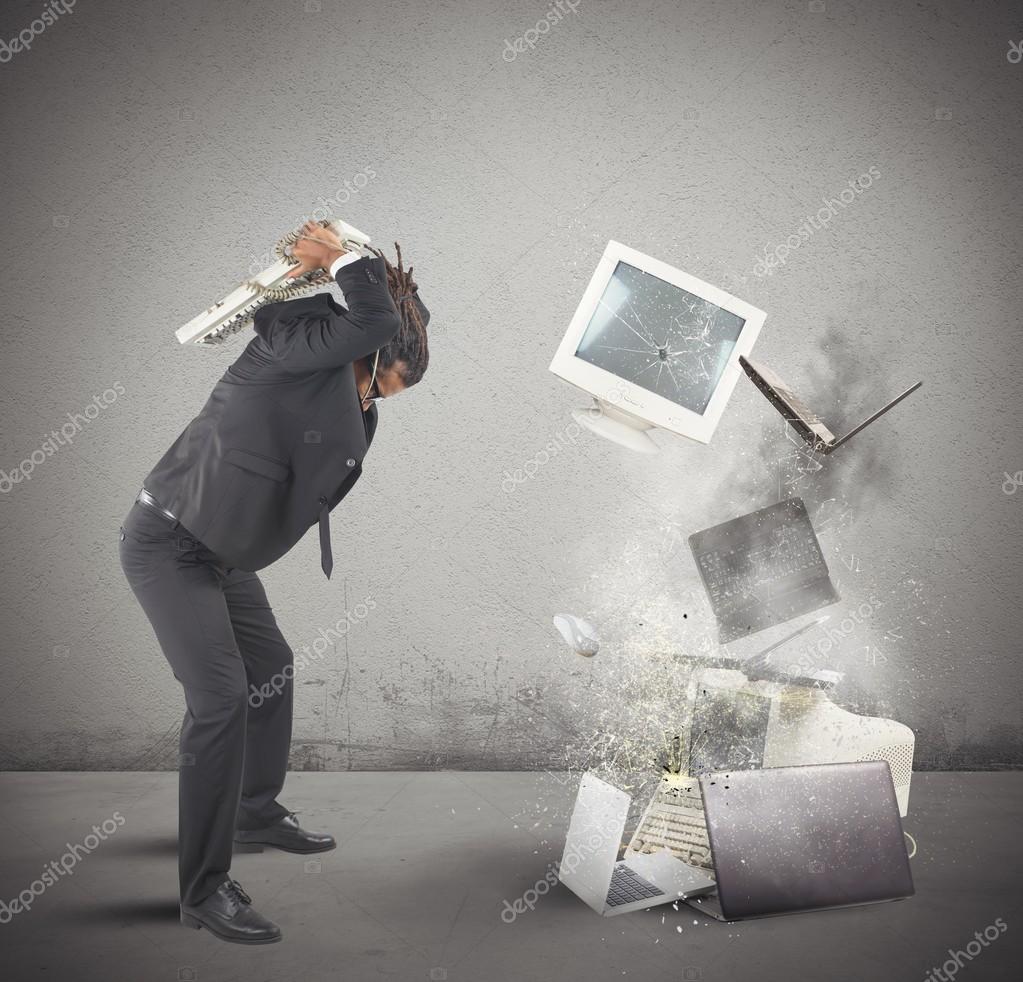 Businessman breaks computers — Stock Photo © alphaspirit #67248849