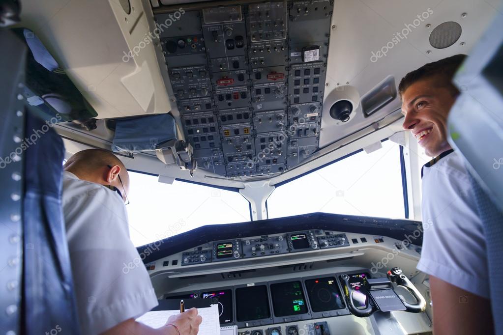 Pilots in aircraft cockpit – Stock Editorial Photo © teamtime #63316557