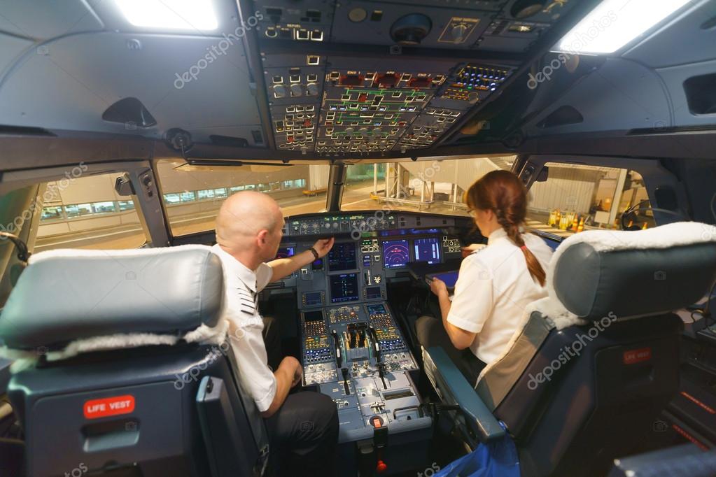 Pilots in aircraft cockpit – Stock Editorial Photo © teamtime #63335825