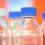 Set of empty plastic chemical bottles with straws in a lab envir Stock ...