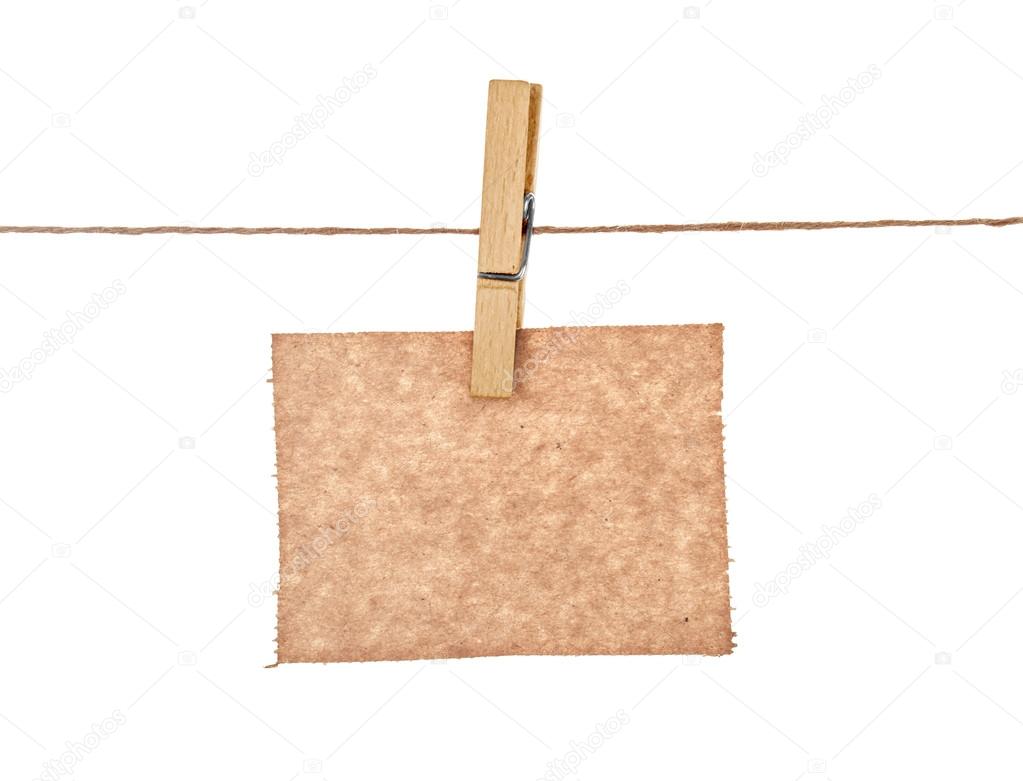 Sheet of kraft paper hanging on a rope with clothespin on a whit Stock ...