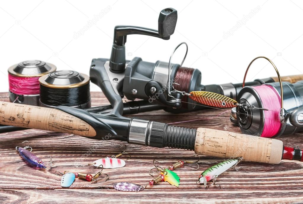 Fishing tackles and spinning Stock Photo by ©doroshin 73476301