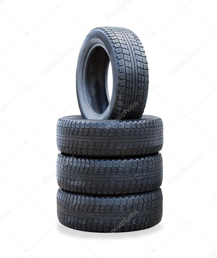 The stack of four winter new tires over white — Stock Photo © Kurganov ...