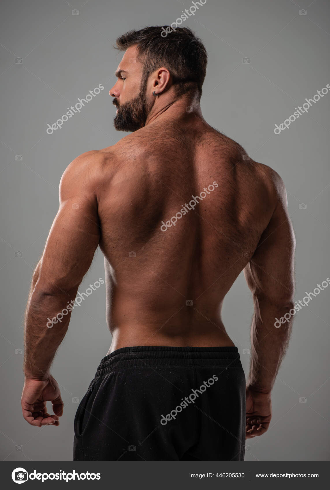 Muscled Male Model Showing His Back — Stock Photo © vishstudio #446205530