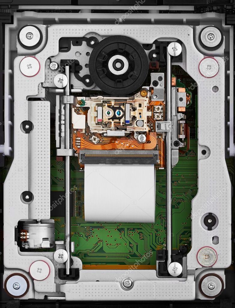 Objective lens and spindle cd-rom drive Stock Photo by ©krasyuk 106119868