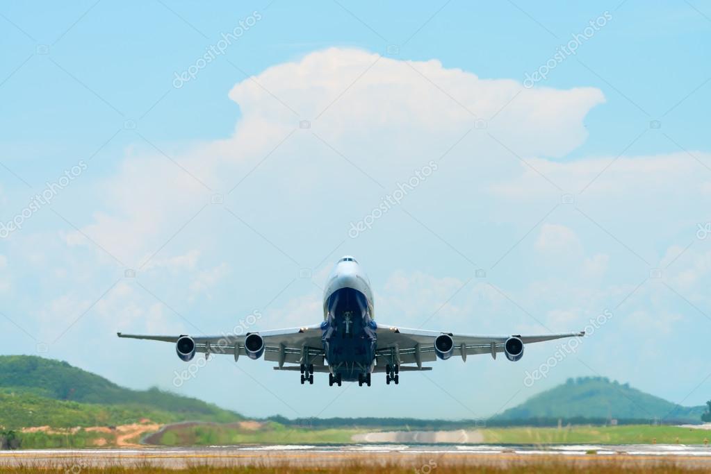 Big passenger airplane flying and taking off from an airport — Stock ...