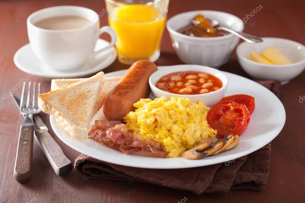 Full english breakfast with scrambled eggs, bacon, sausage, bean Stock ...