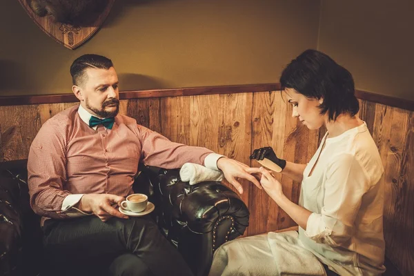 Old-fashioned man doing male manicure — Stock Photo © nejron #104635768