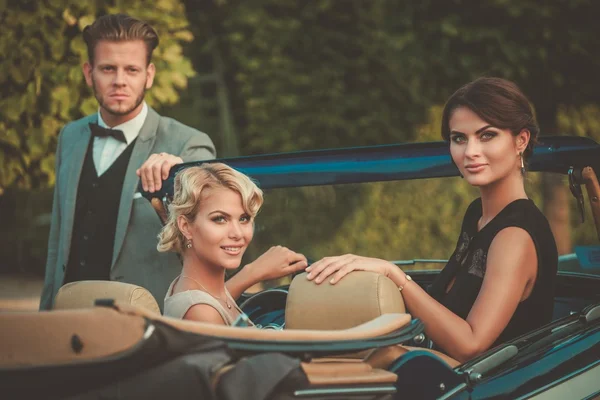Friends in a classic convertible Stock Photo by ©nejron 81564320