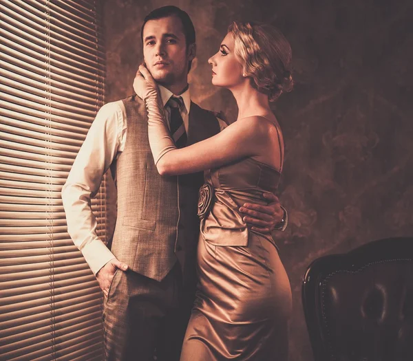 Retro couple near a window Stock Photo by ©nejron 12454701