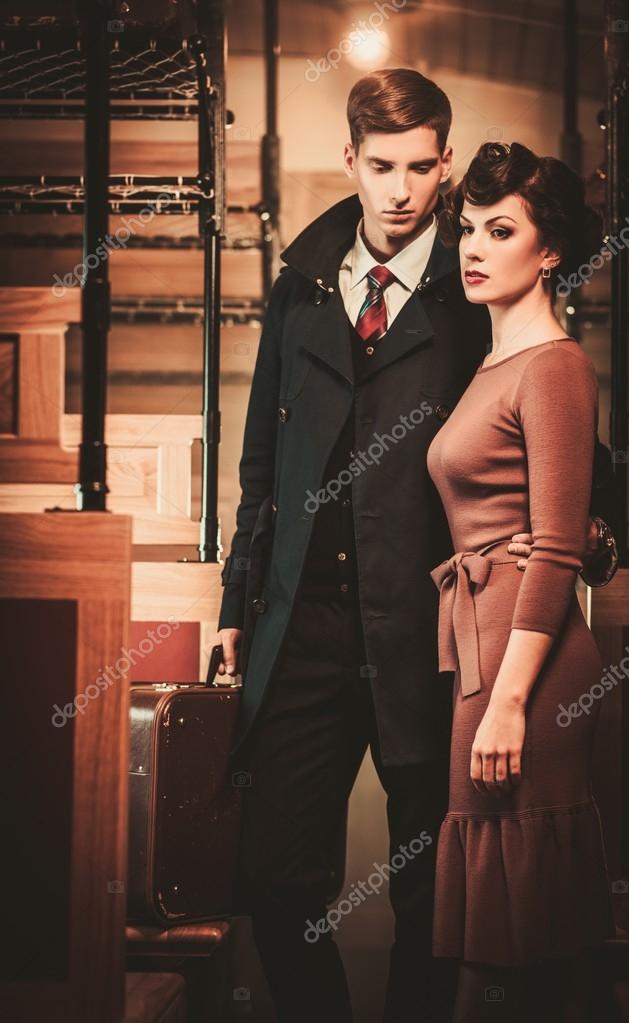 Couple inside retro train coach Stock Photo by ©nejron 63053145
