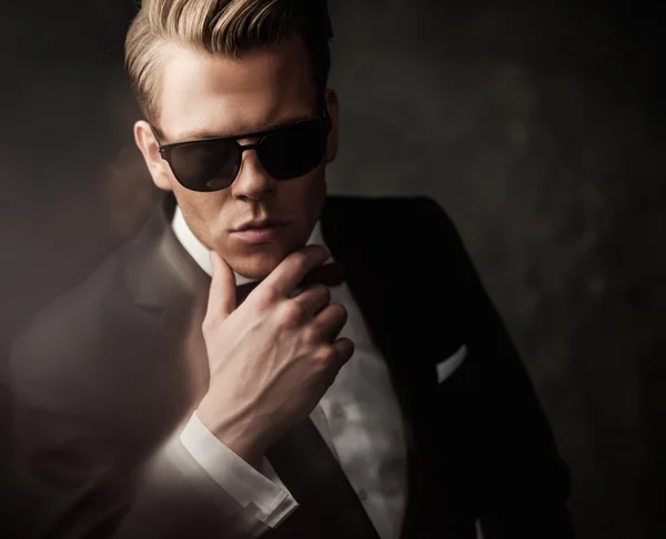 Tough sharp dressed man in black suit - Stock Image - Everypixel