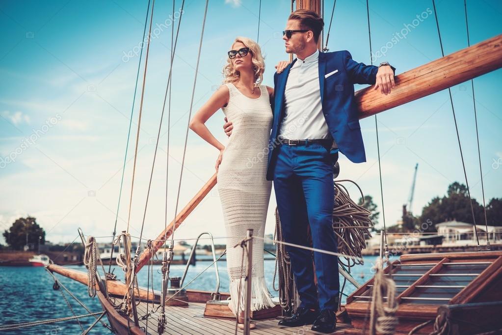 Wealthy couple on a luxury yacht Stock Photo by ©nejron 78989450