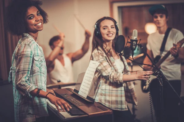 music band performing in a recording studio - Stock Image - Everypixel