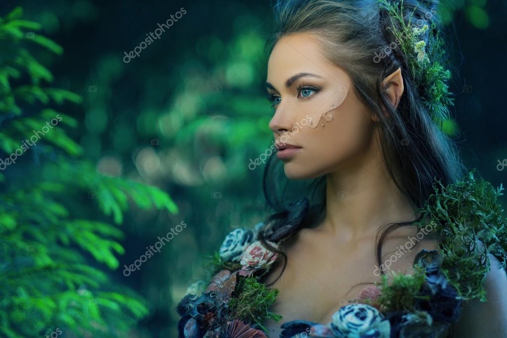Elf woman in a magical forest — Stock Photo © nejron #80541446