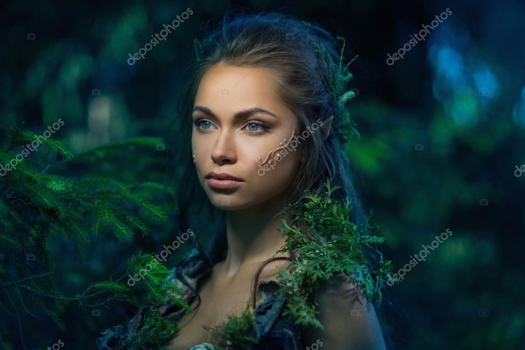 Elf woman in a magical forest — Stock Photo © nejron #80541462