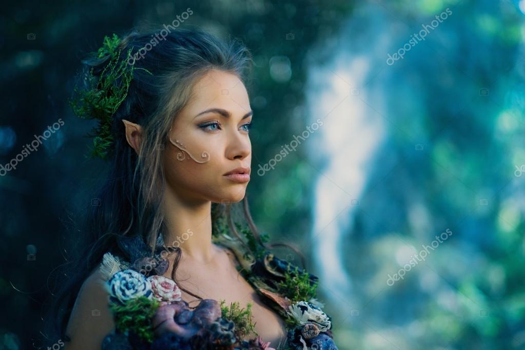 Elf woman in a magical forest — Stock Photo © nejron #80925476