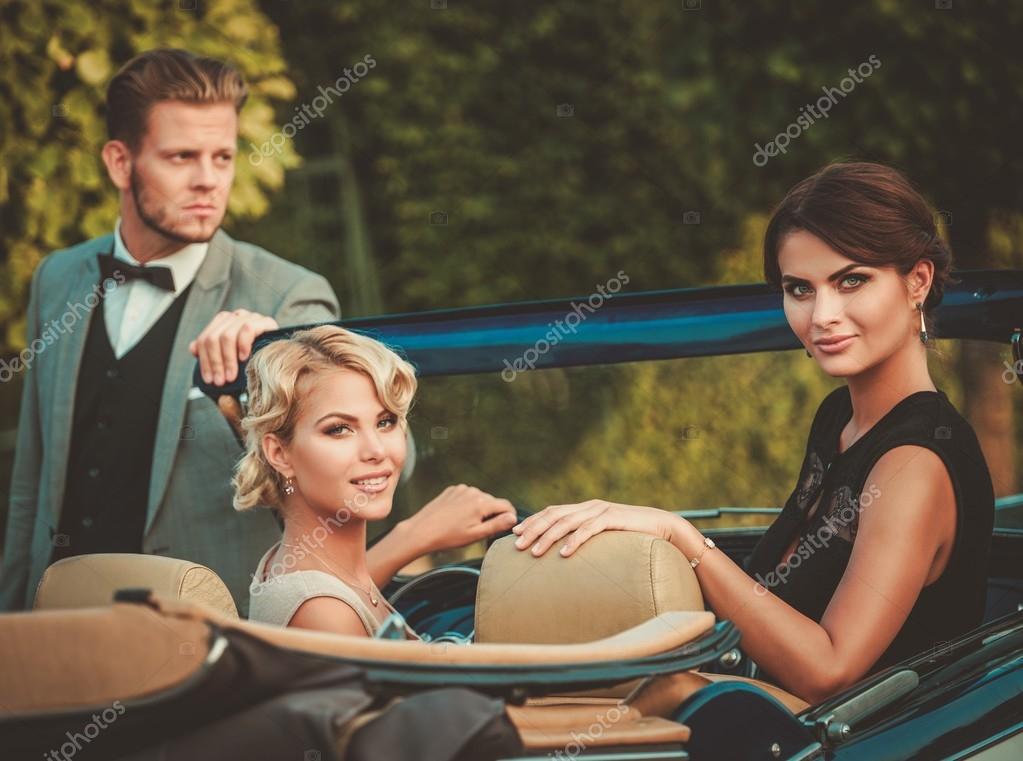 Friends in a classic convertible Stock Photo by ©nejron 81564320