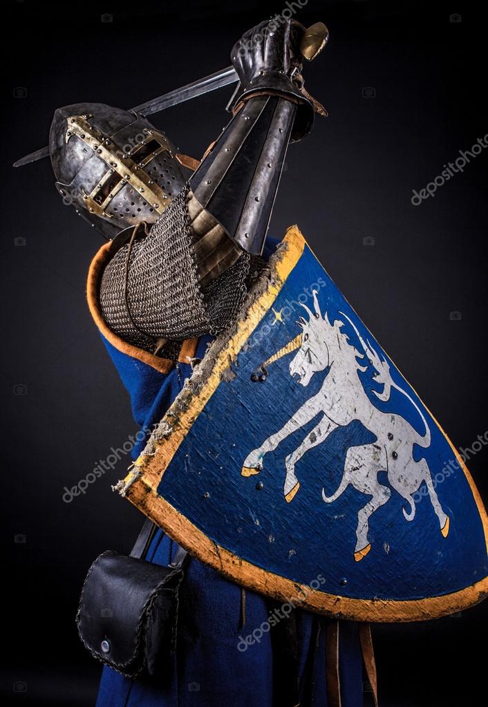 A knight with a sword and helmet Stock Photo by ©fxquadro 100906244