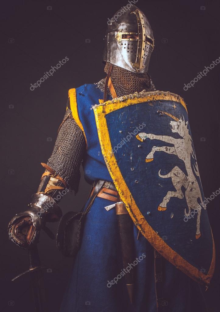 A knight with a sword and helmet Stock Photo by ©fxquadro 103576118
