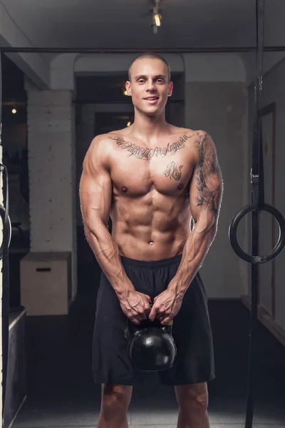 bodybuilder holds lifting weight - Stock Image - Everypixel