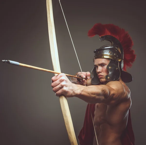 Muscular male model with bow Stock Photo by ©fxquadro 109101070
