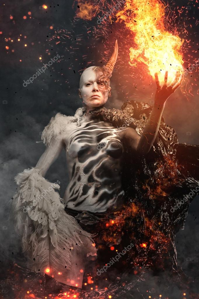 Devil woman with horn in a fire — Stock Photo © fxquadro #110973348