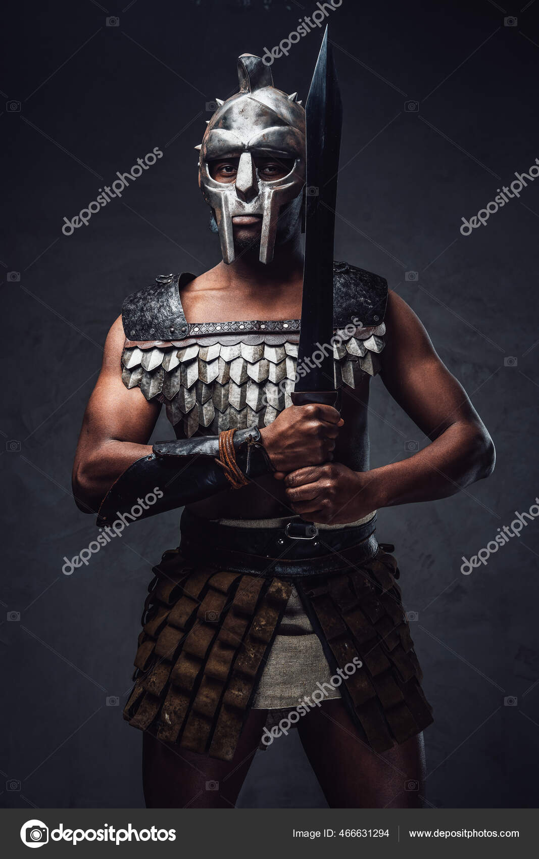 Proud antique gladiator with sword against dark background — Stock ...
