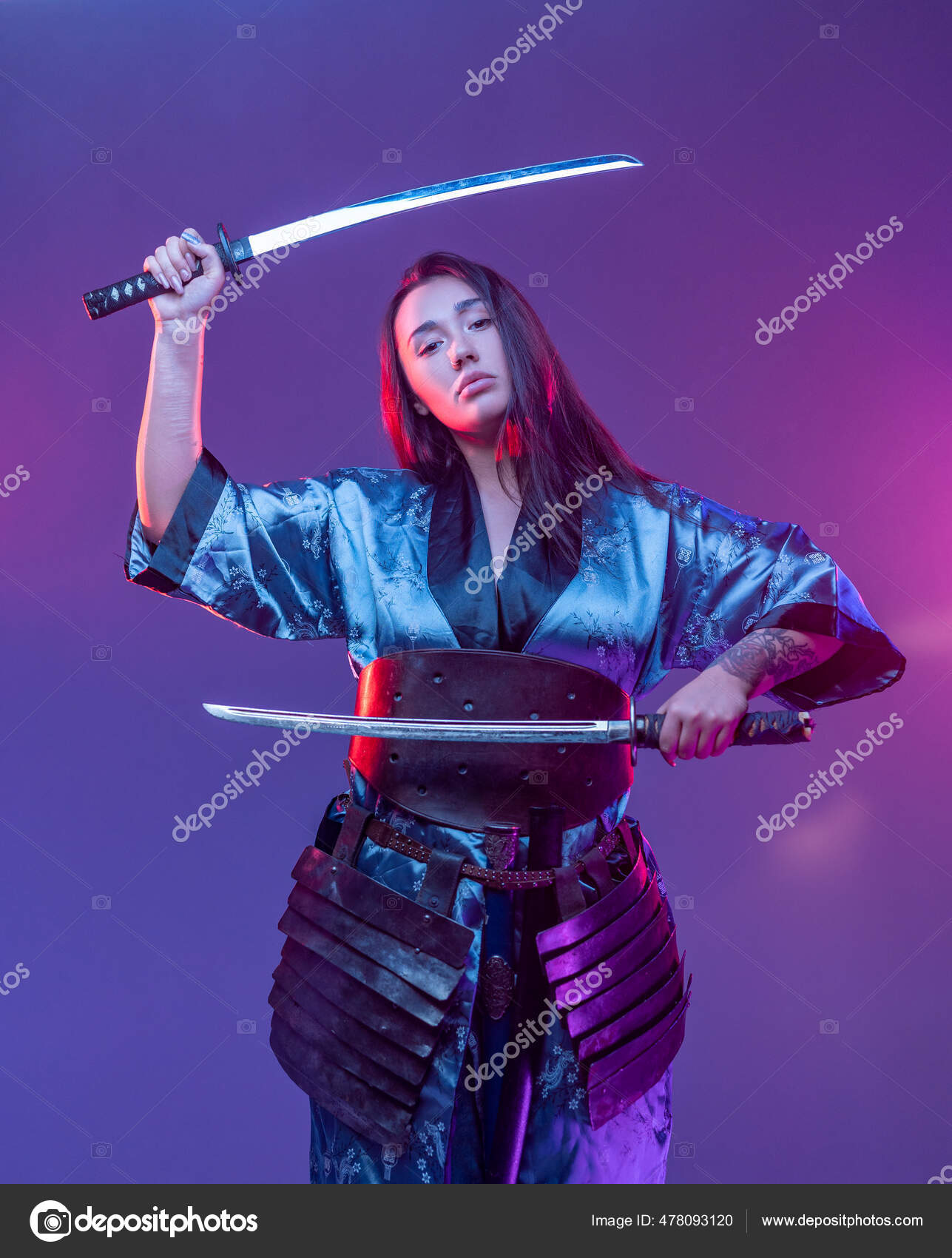 Eastern female warrior with katanas in fight stance Stock Photo by ...
