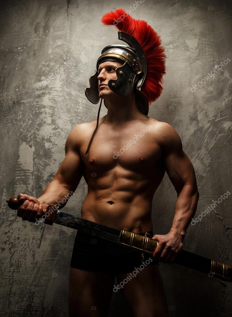 Muscular male warrior posing showing his body — Stock Photo © fxquadro ...