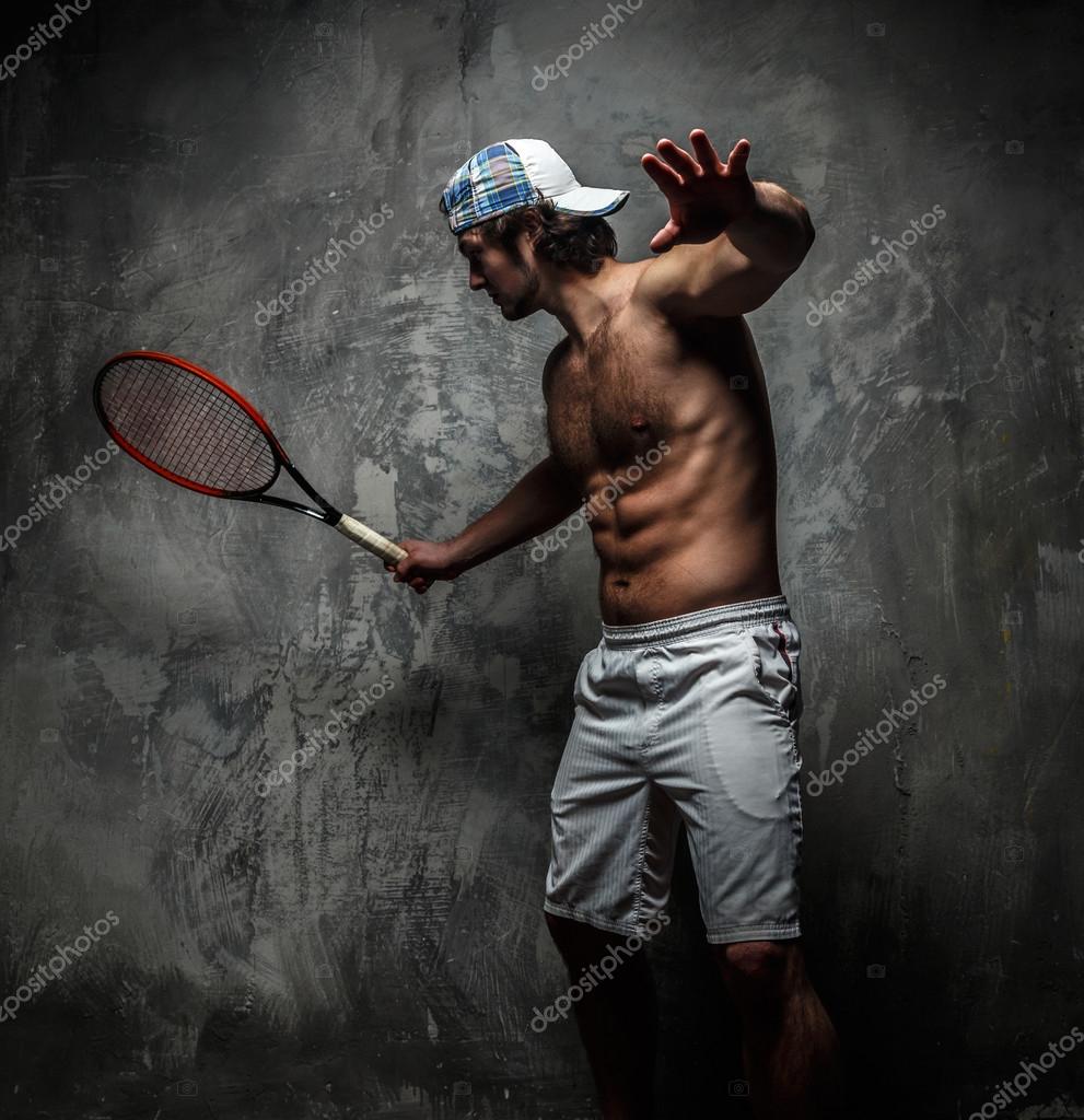 Male tennis player with racket. Stock Photo by ©fxquadro 66175731