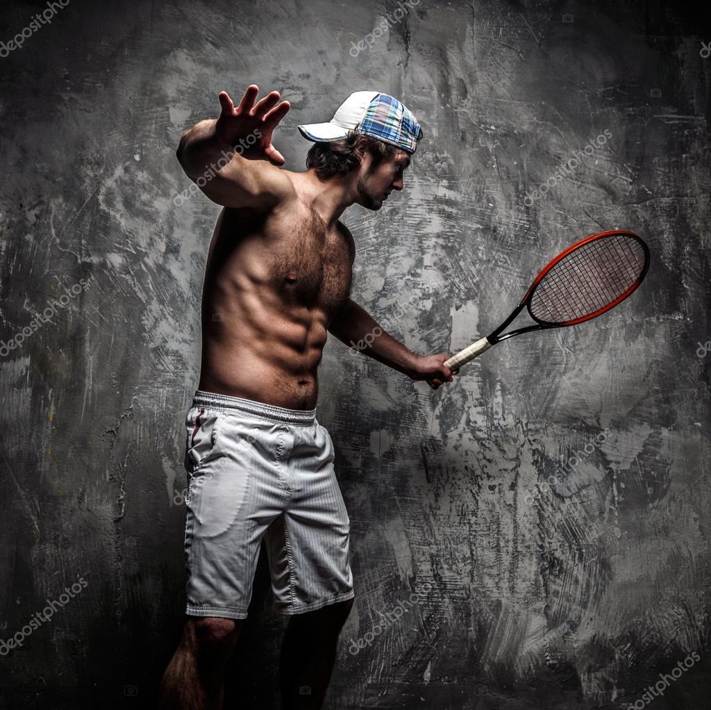 Male tennis player with racket. Stock Photo by ©fxquadro 68433701