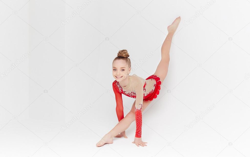 Attractive young girl doing split Stock Photo by ©fxquadro 71054455