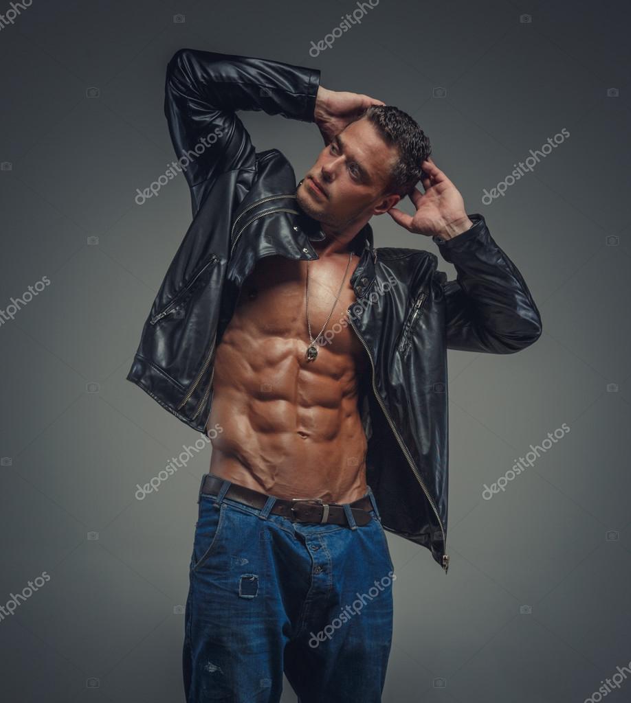 Muscular guy in jeans and black jacket Stock Photo by ©fxquadro 75726367