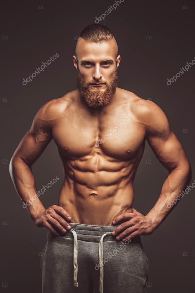 Muscular man with beard. Stock Photo by ©fxquadro 85716198