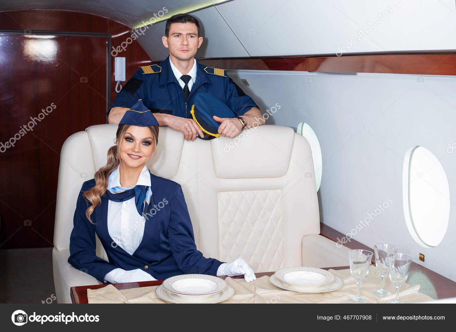 Pilot and a flight attendant on board the plane, the cabin of a private ...