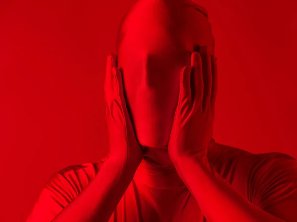 Crazy red man on a red background. figure in a leotard covering the ...