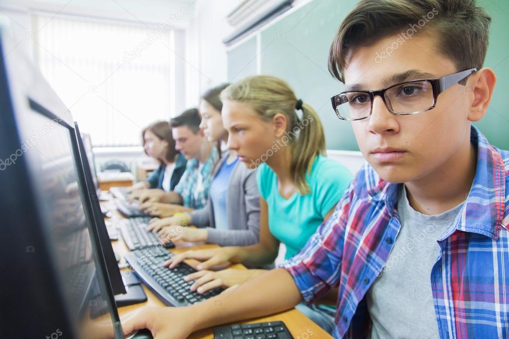 Young people in computing class Stock Photo by ©yanlev 78016842